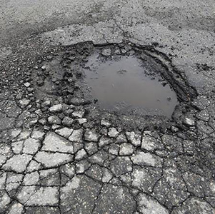 UK potholes combined reached a depth of 40km - almost four times as ...